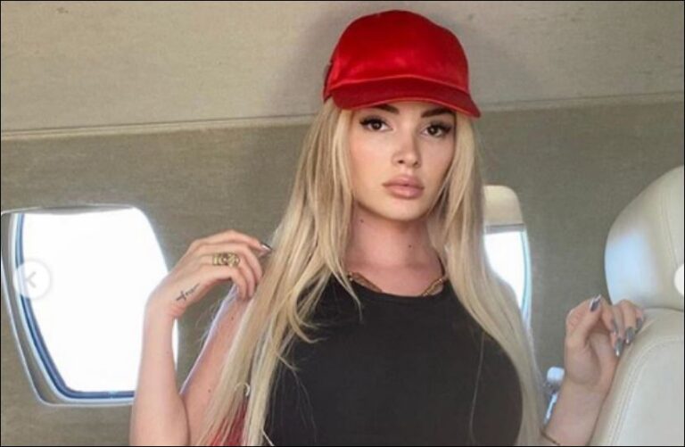 Era Istrefi pozon seksi para makinës së saj luksoze